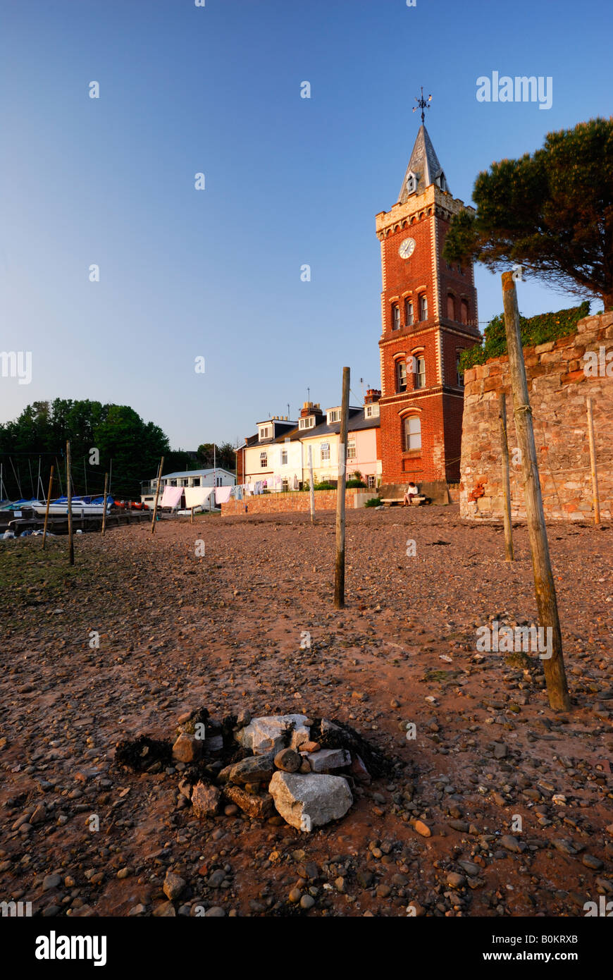 View of clock tower at Lympstone, Devon, UK from the Exe Estuary at low ...