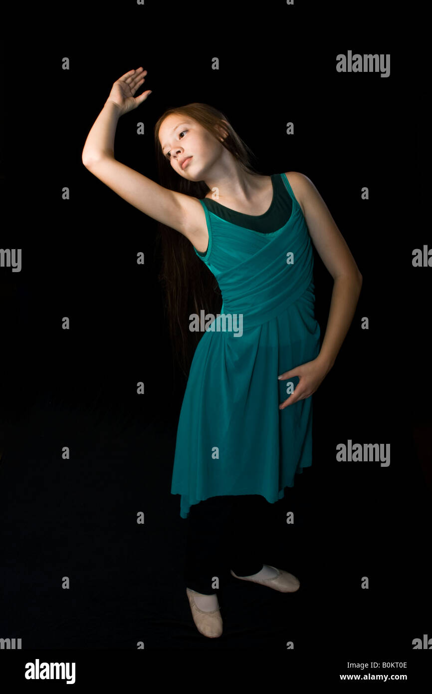 Girl in standing pose for ballet Stock Photo - Alamy