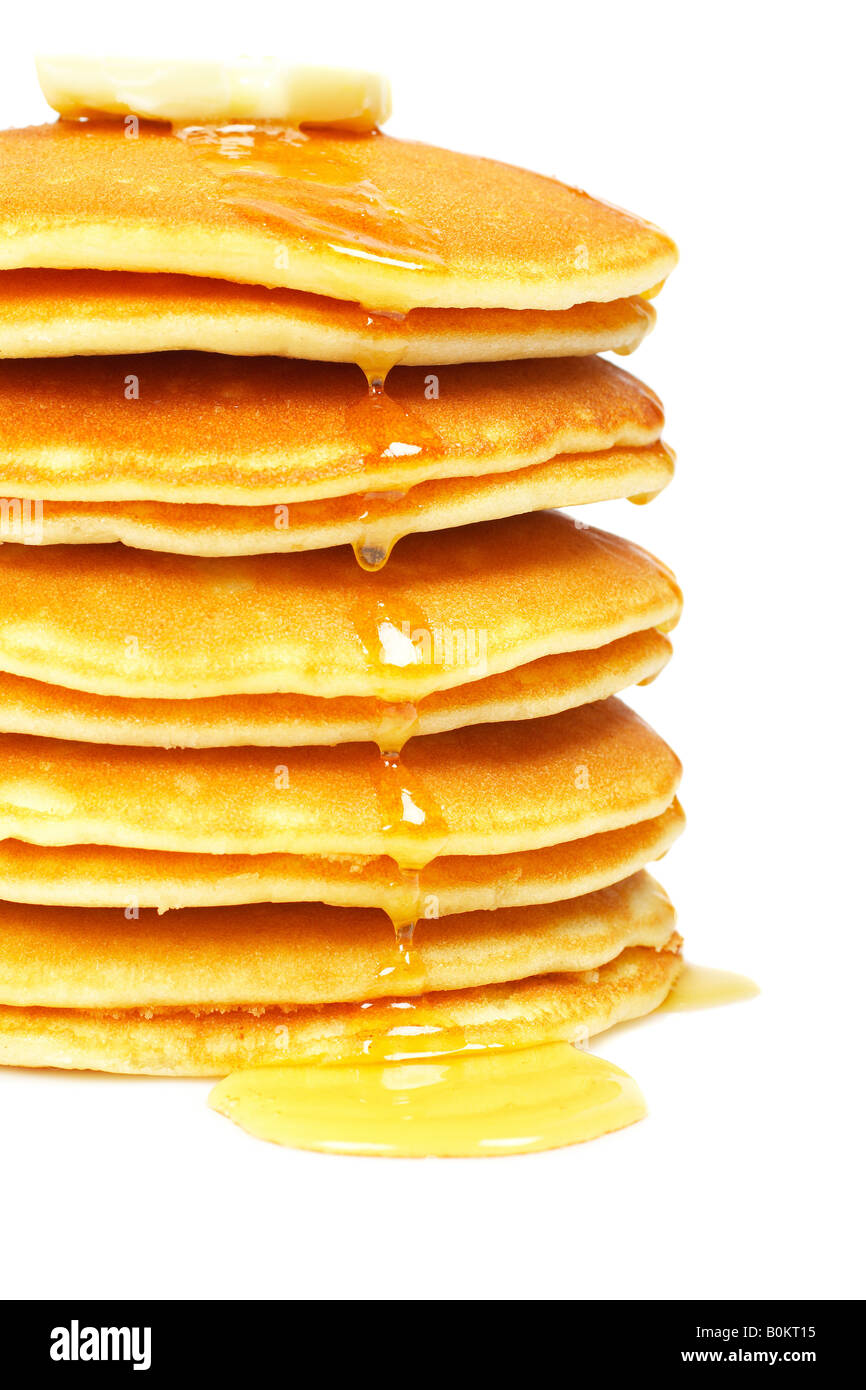 A big stack of pancakes with syrup and butter on focus Shallow depth of ...