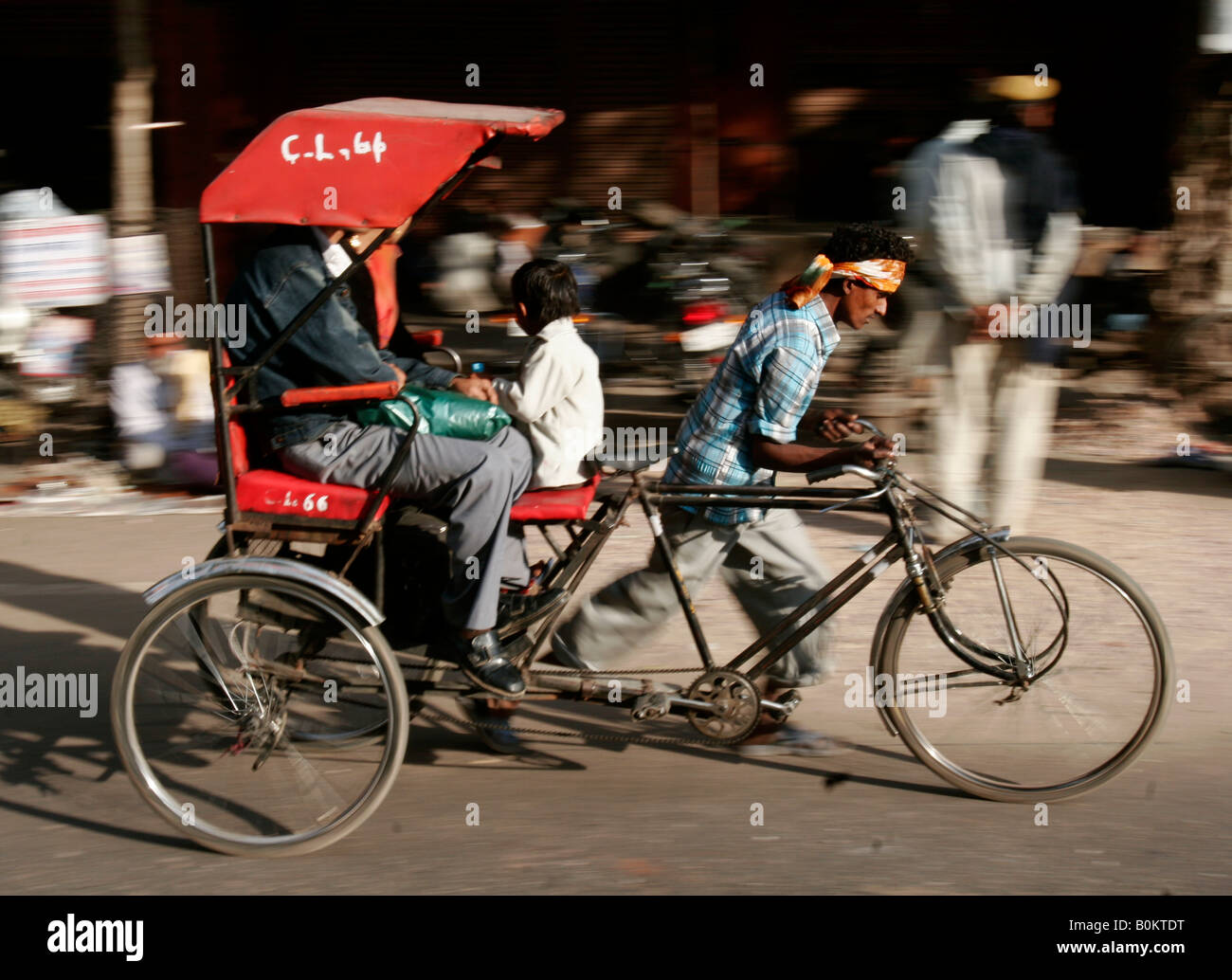 Indian taxi rickshaw driver in busy city street, India Stock Photo - Alamy