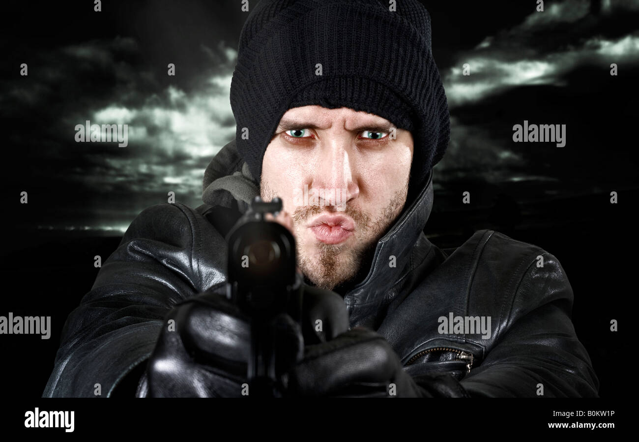Portrait of an undercover agent or delinquent dressed in black leather ...