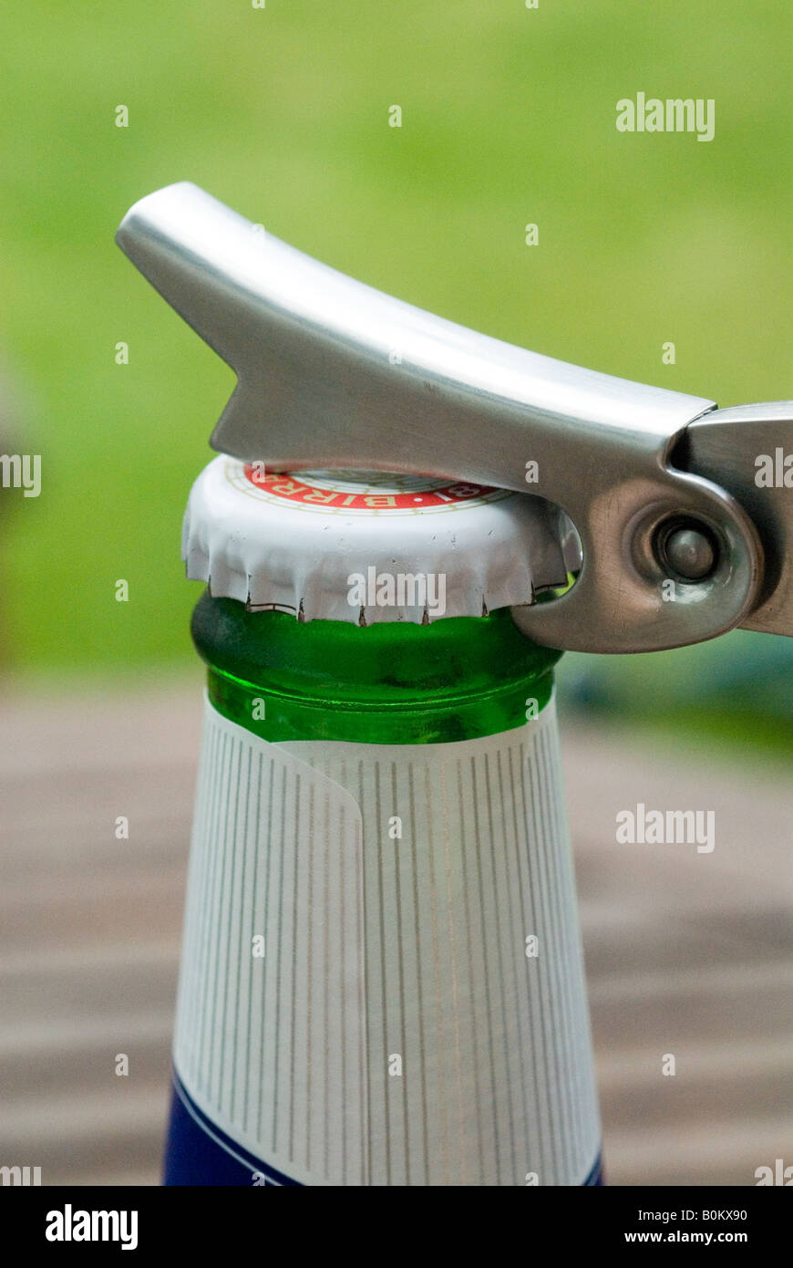 Beer Bottle Being Opened Stock Photo - Alamy