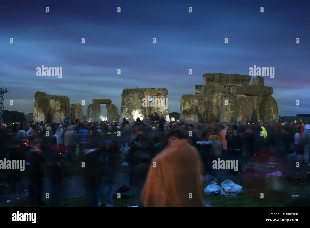 The towering stones rise above a moving sea of people, all awaiting the ...