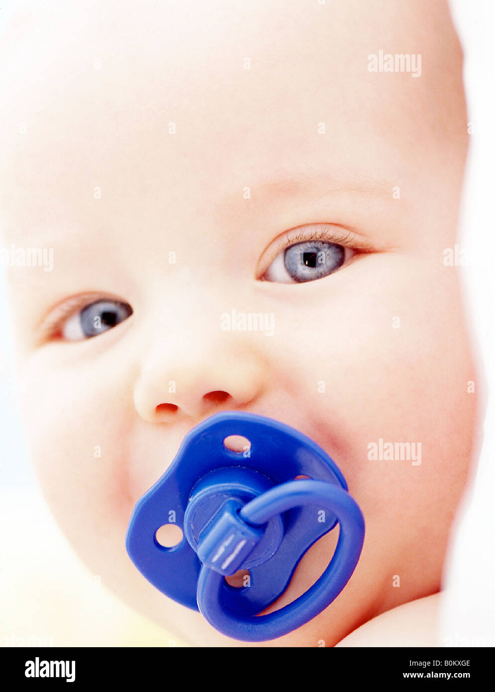 Adorable baby with pacifier Stock Photo - Alamy