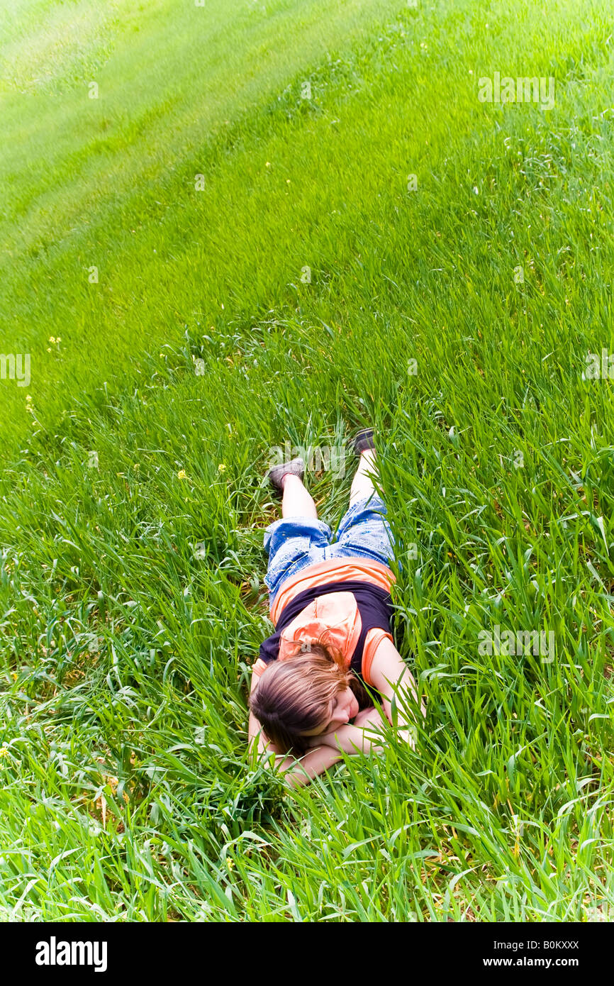 Blonde woman portrait over the grass Stock Photo - Alamy