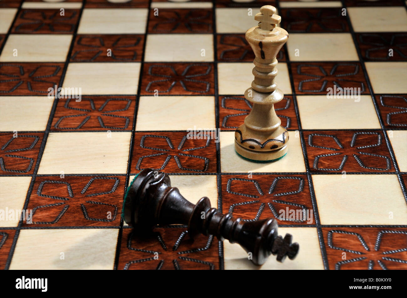 Two kings on a chess board Stock Photo - Alamy