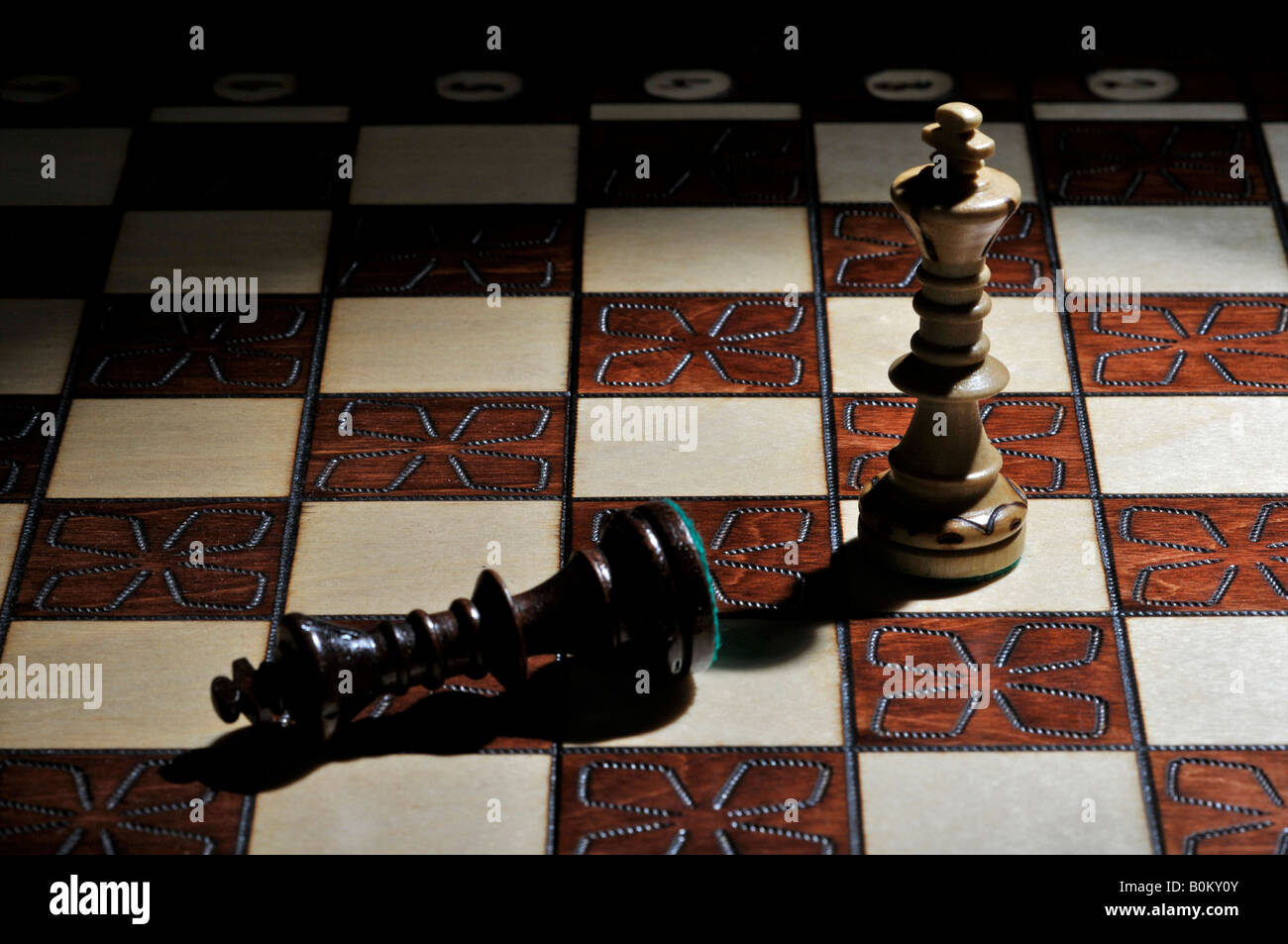 Two kings on a chess board Stock Photo - Alamy