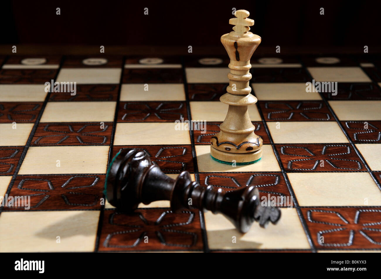 Two kings on a chess board Stock Photo - Alamy