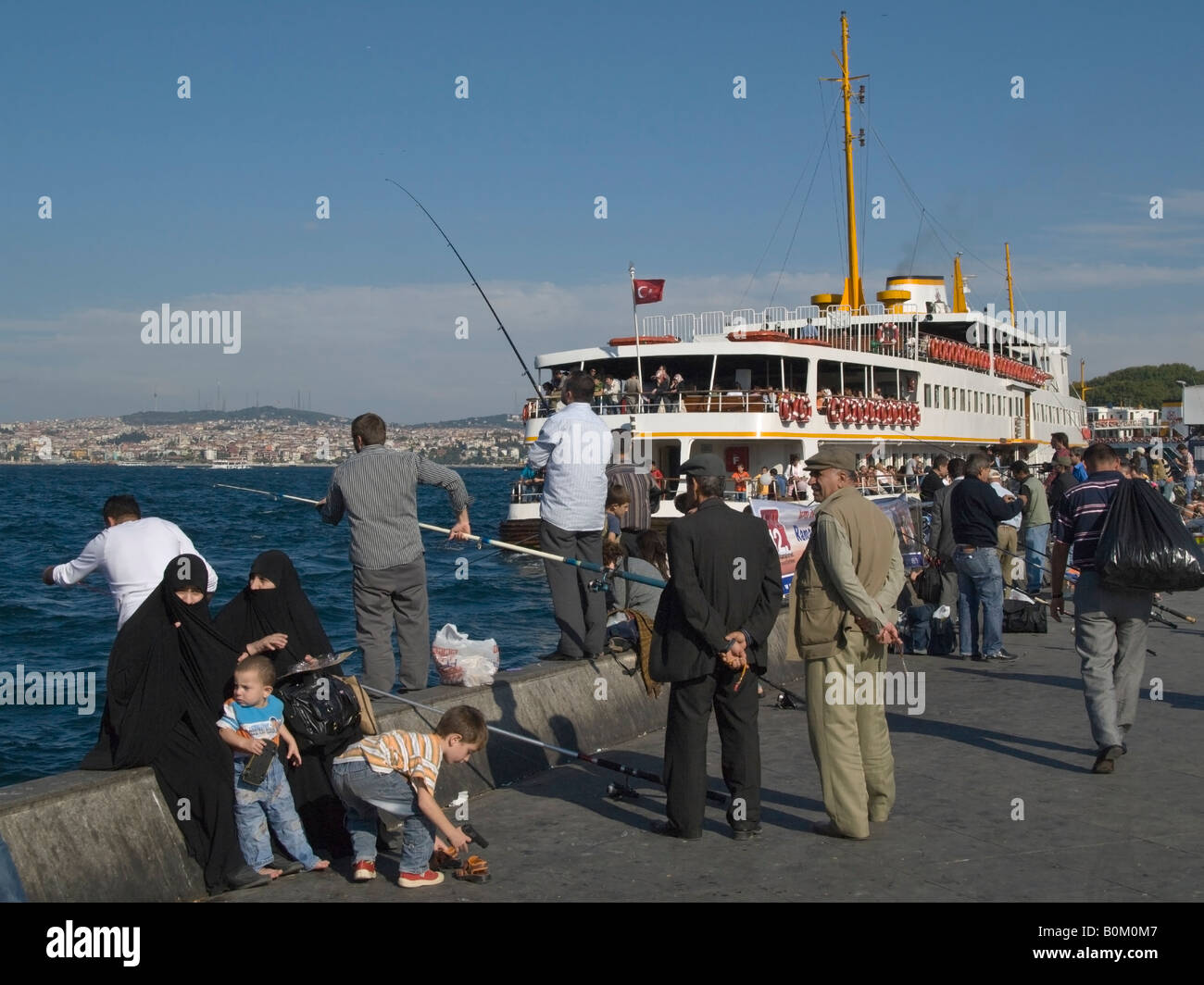 Fishing at the eminonu waterfront hi-res stock photography and images ...