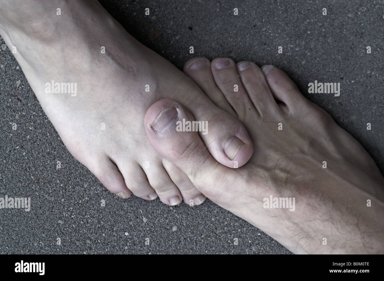 Two human man woman bare feet connected love Stock Photo - Alamy