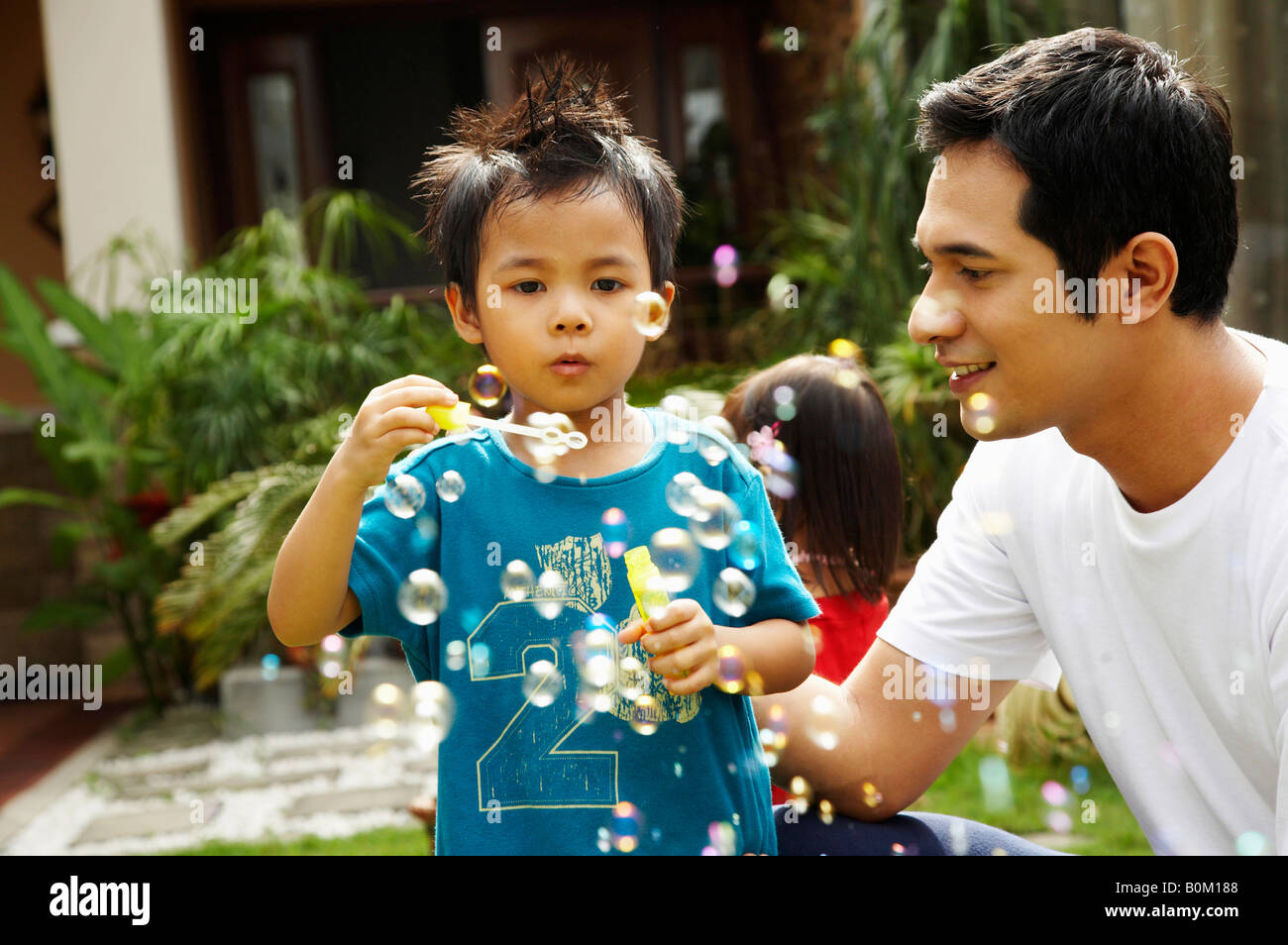 Father having fun with children Stock Photo - Alamy