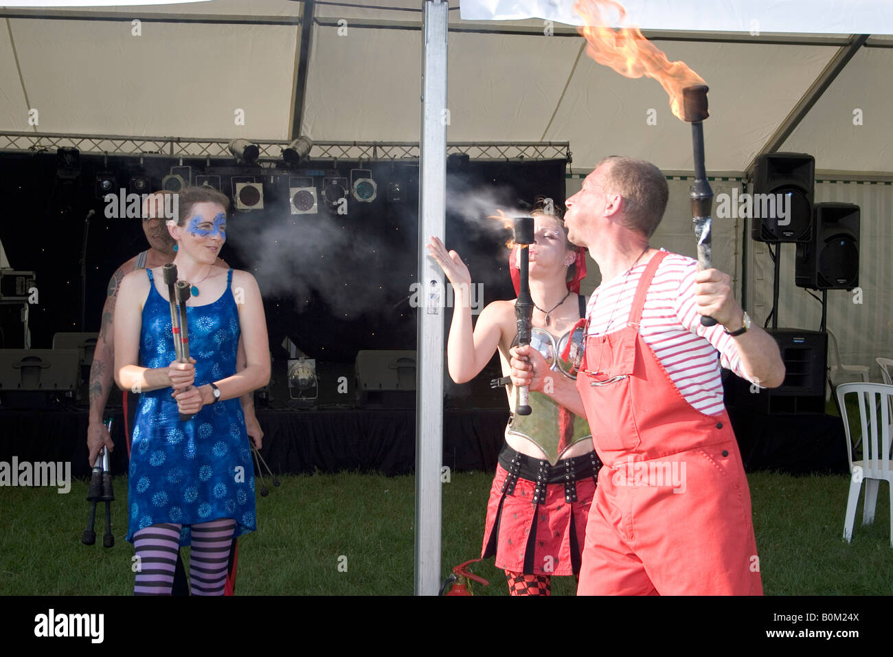 Fire eater at festival in sussex England Stock Photo - Alamy