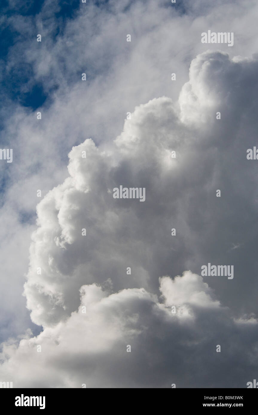 Expanding cumulus strong storm clouds expanding in air below higher ...