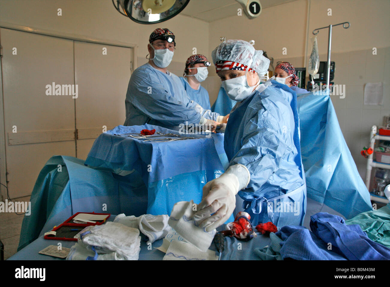 A surgical team operates on a patient during a 2006 surgical mission to ...