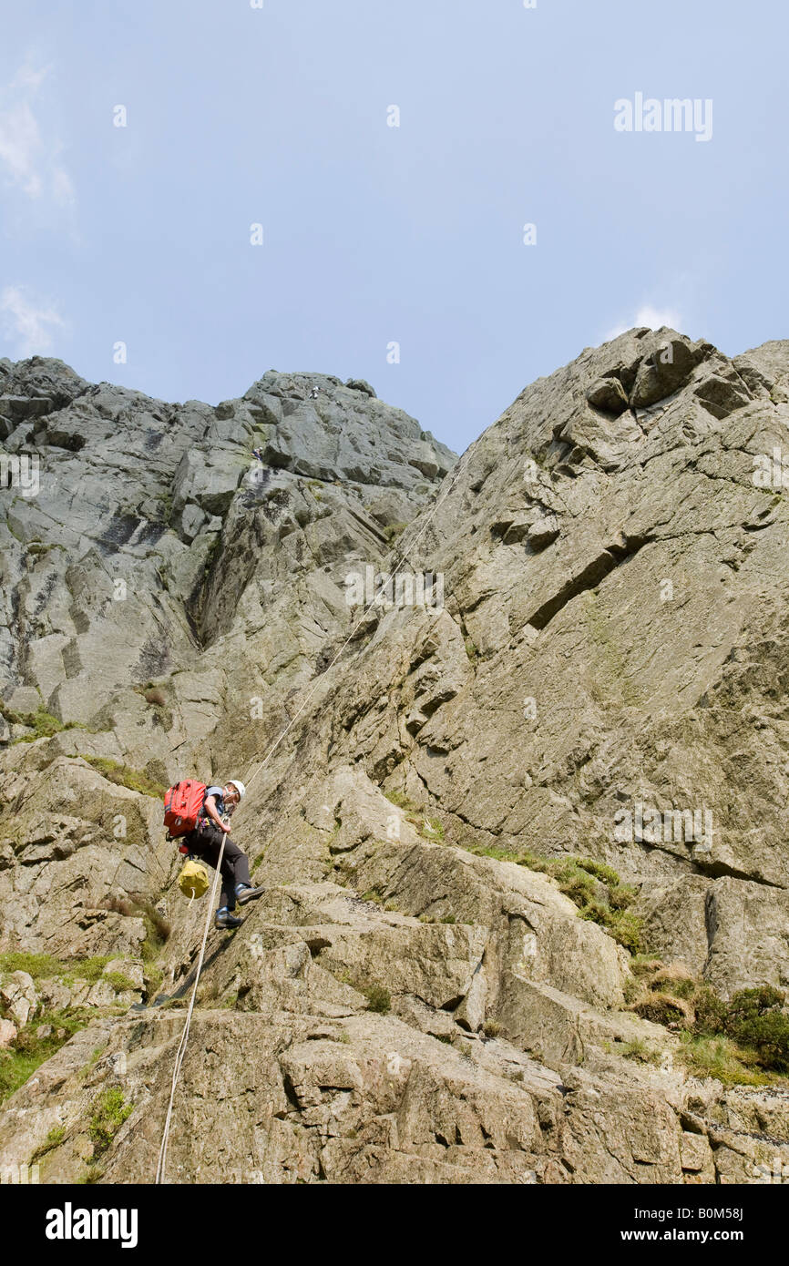 A man abseils off Gimmer Crag in the Lakle district Stock Photo - Alamy