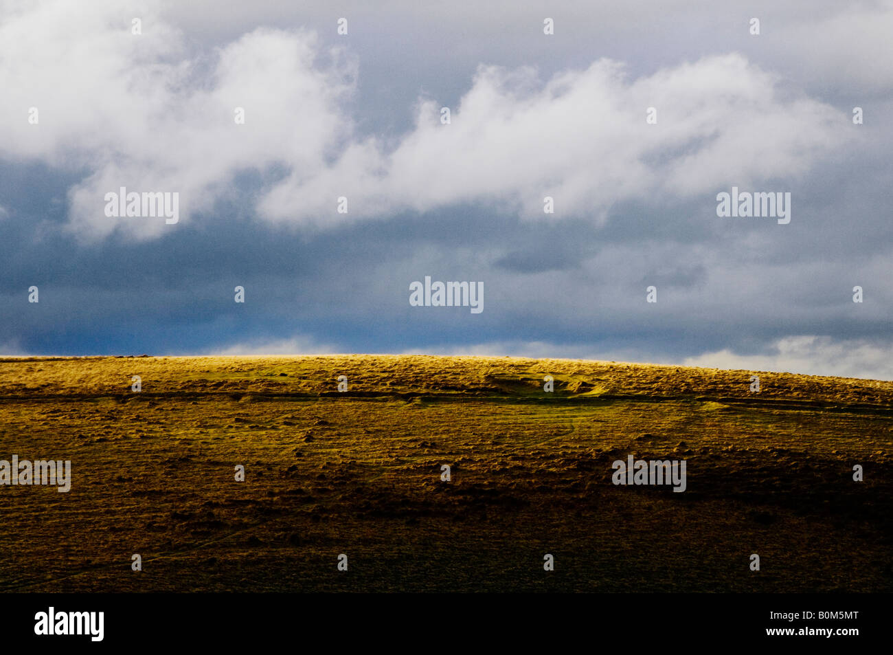 Sunlight peering through stormy clouds at Bodmin moor Stock Photo - Alamy