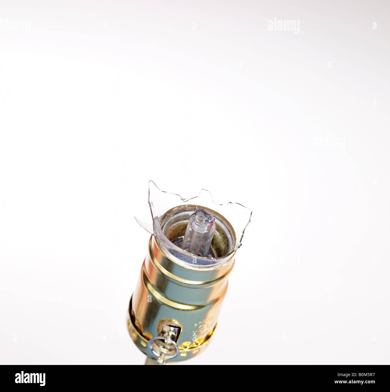 Broken lightbulb in the socket against white background Stock Photo - Alamy