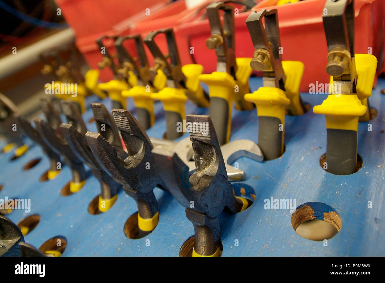 Rack of pliers and wire strippers in a workshop Stock Photo - Alamy