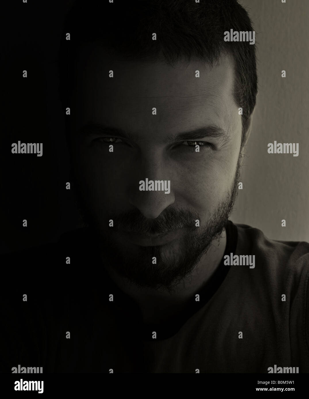 Obscure portrait of malice man with sparkling eyes Stock Photo - Alamy