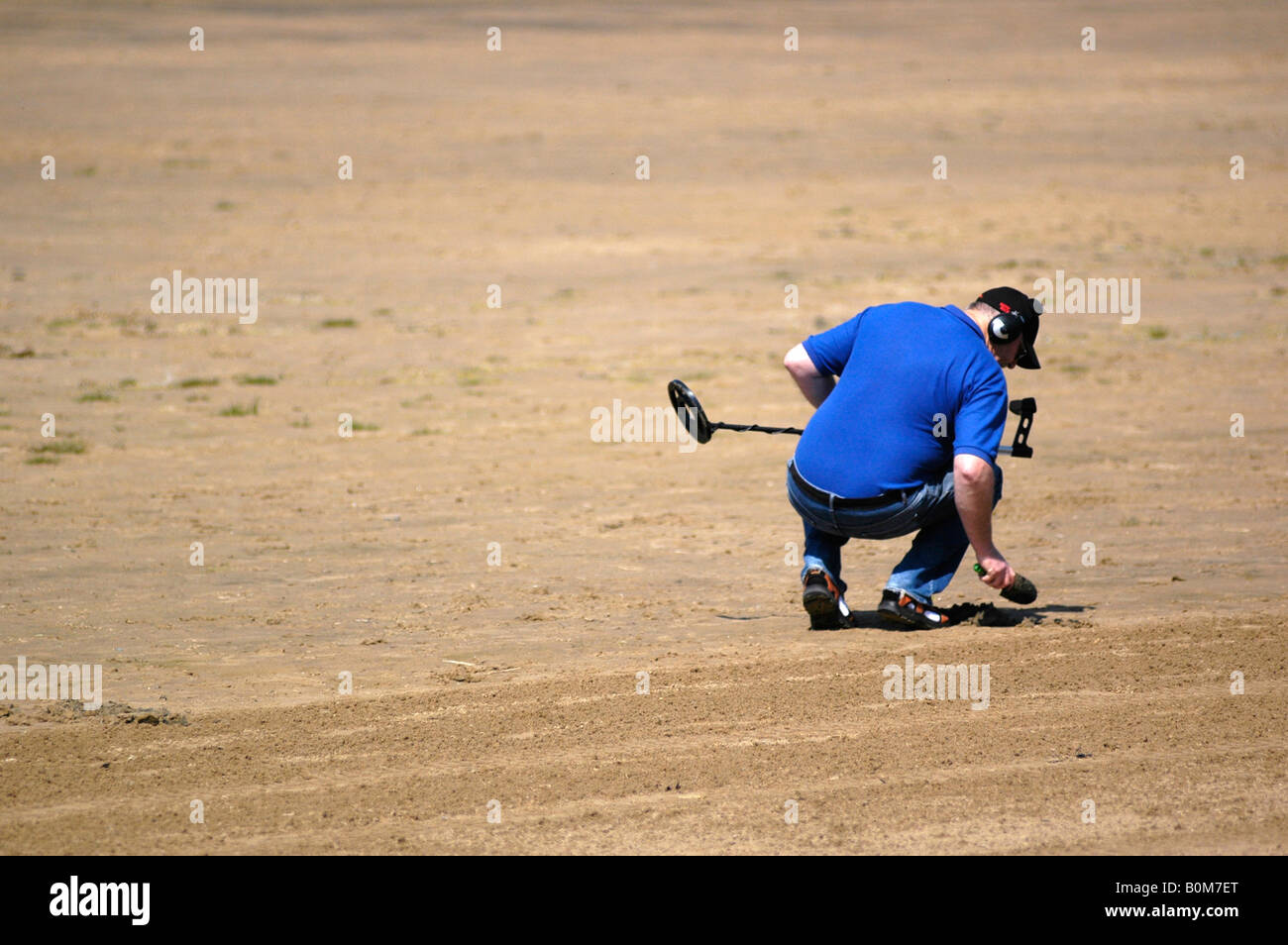 Man using metal detector on hi-res stock photography and images - Alamy