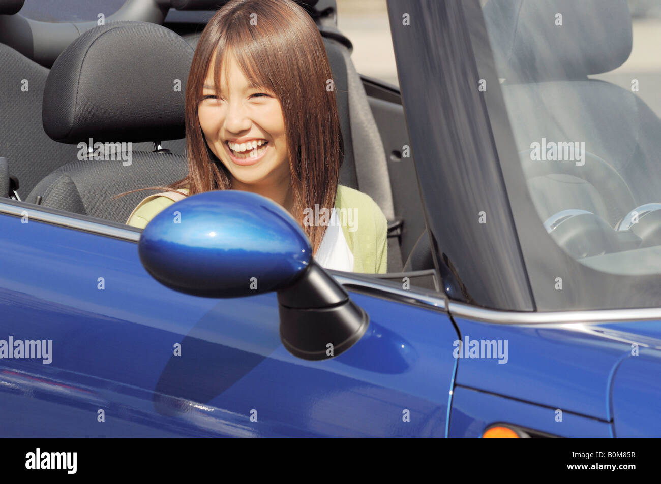 Japanese young woman driving a car Stock Photo - Alamy