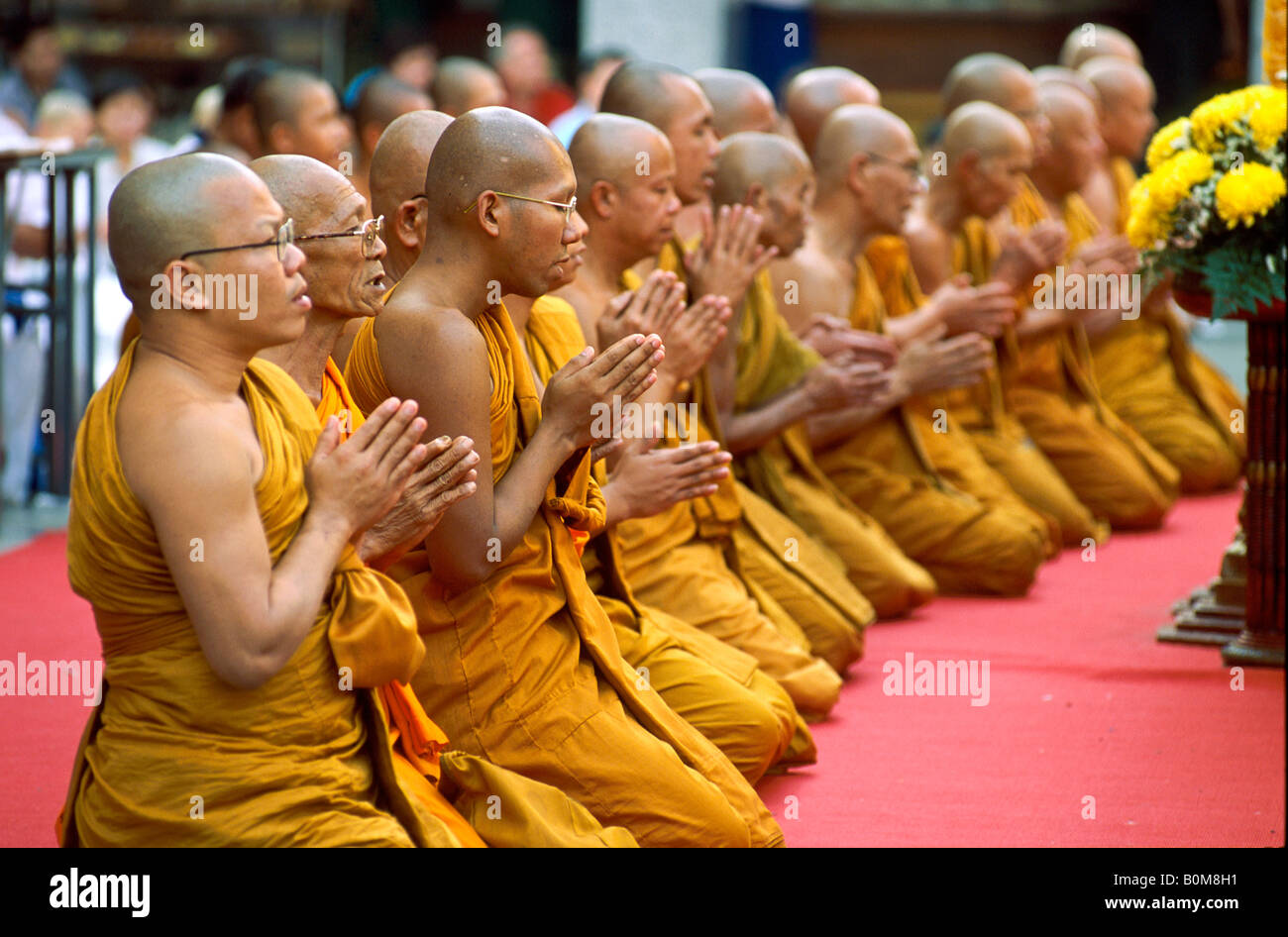 Monks pray during a Buddhist ritual and ceremony of making merit at Wat ...