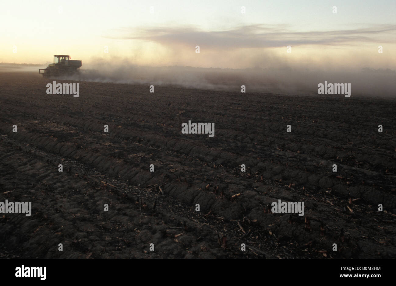 Fertilizer is applied to a stubble paddock early evening Hay New South ...