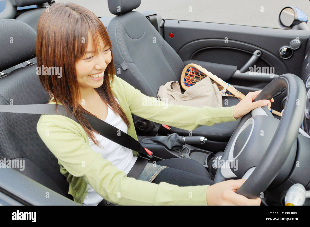 Japanese young girl driving a car Stock Photo - Alamy