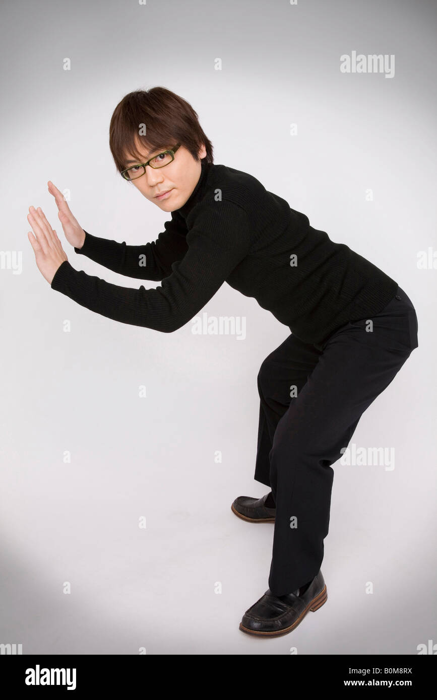Japanese man acting out a pantomime Stock Photo - Alamy