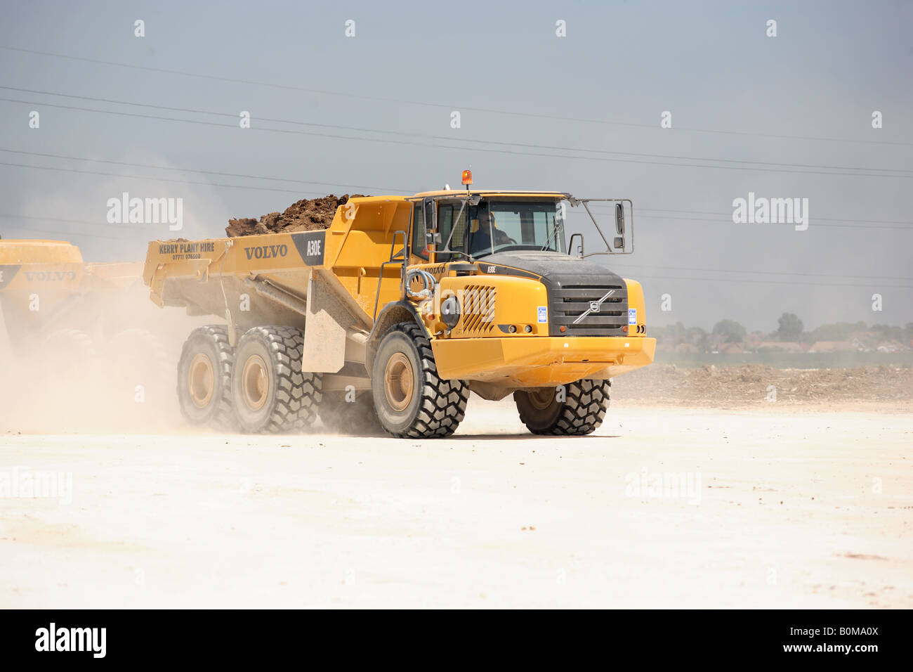A large earth moving truck on a building site Stock Photo - Alamy