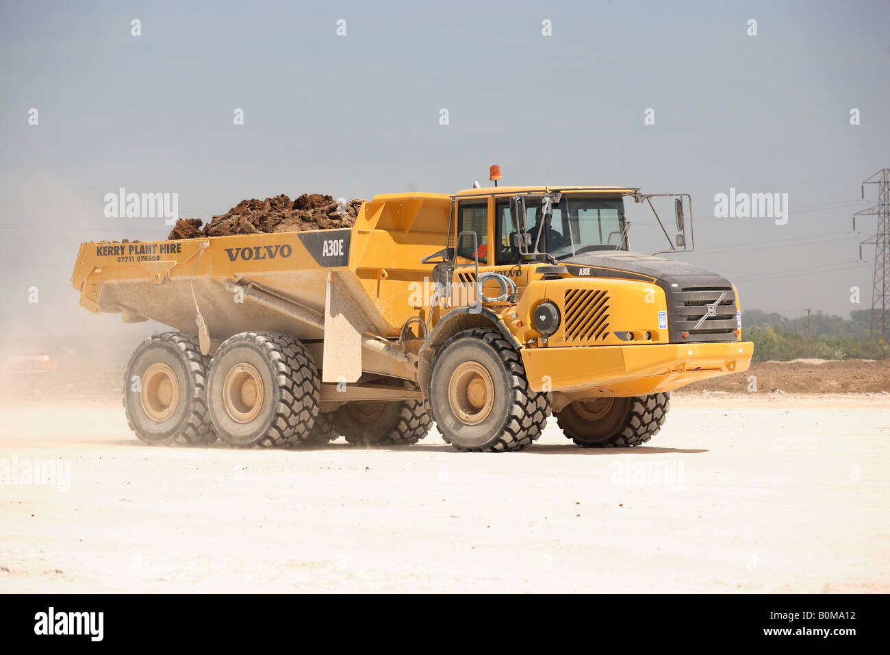 A large earth moving truck on a building site Stock Photo - Alamy