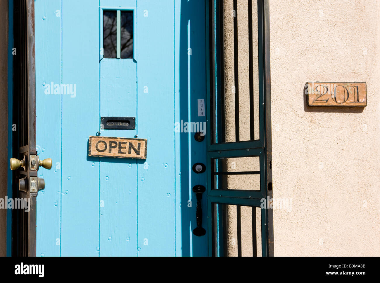 Wood door with OPEN sign Stock Photo - Alamy
