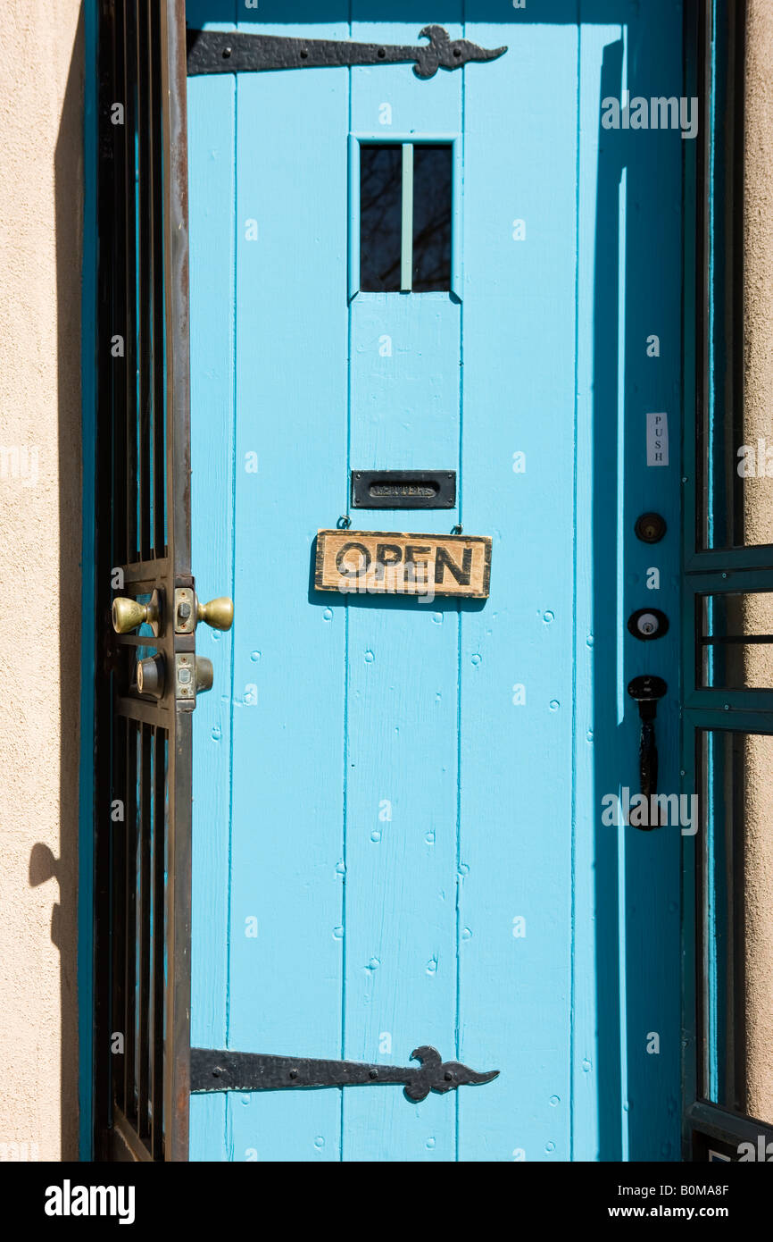 Wood door with OPEN sign Stock Photo - Alamy