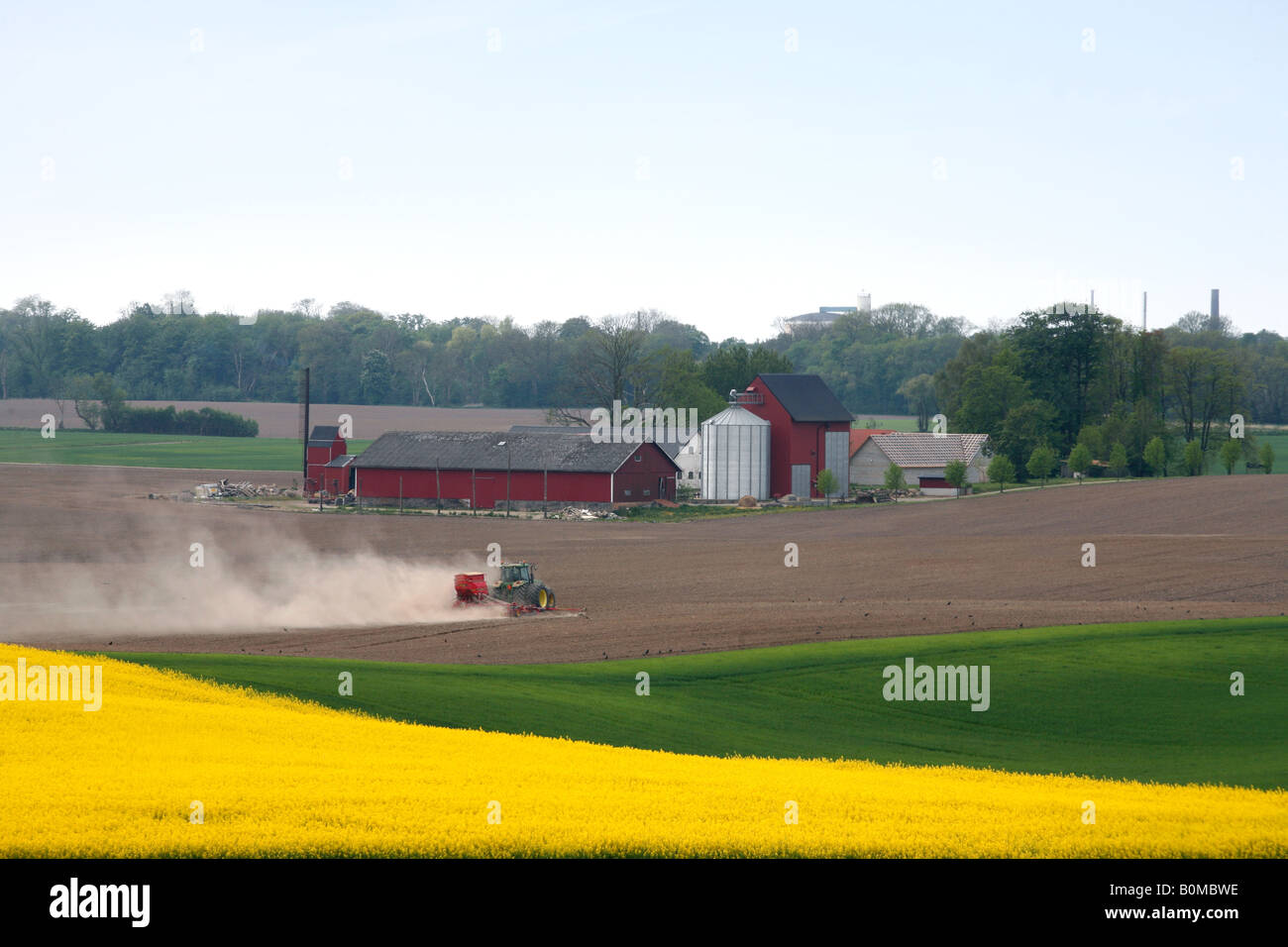 Red Tractor Plowing in spring Stock Photo - Alamy