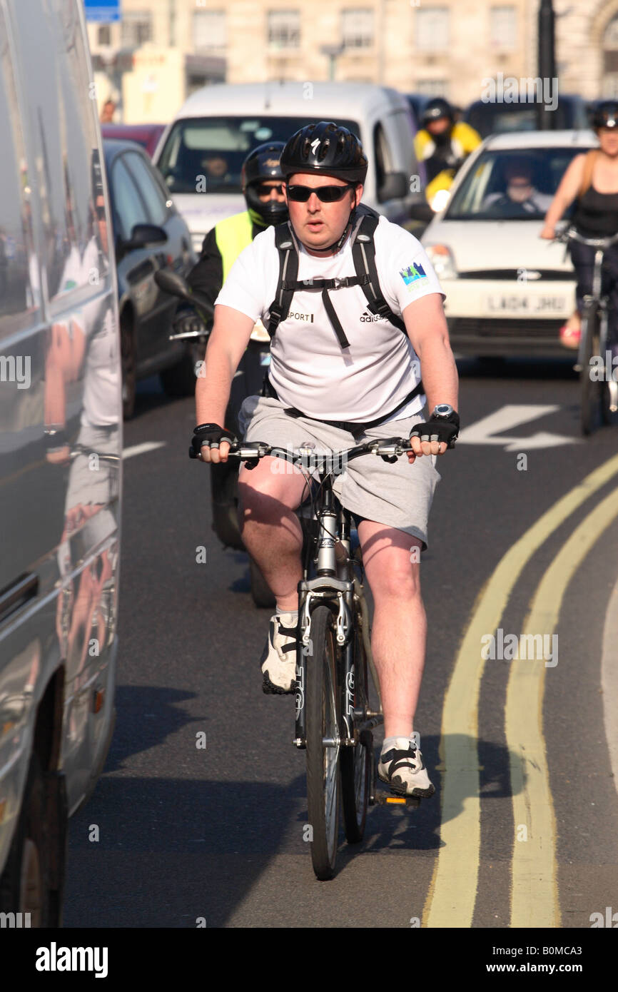 Cycling through busy city hi-res stock photography and images - Alamy