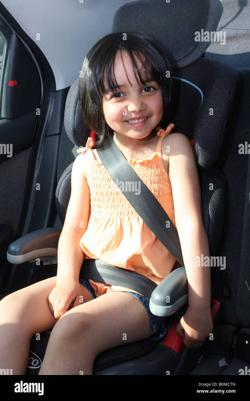 A girl sat on a car seat inside a car Stock Photo - Alamy