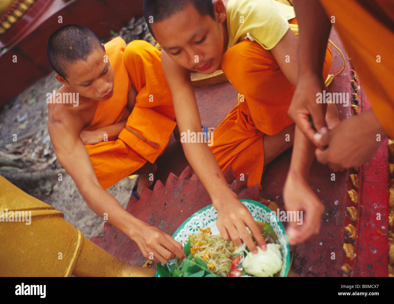 Novice monks eating hi-res stock photography and images - Alamy