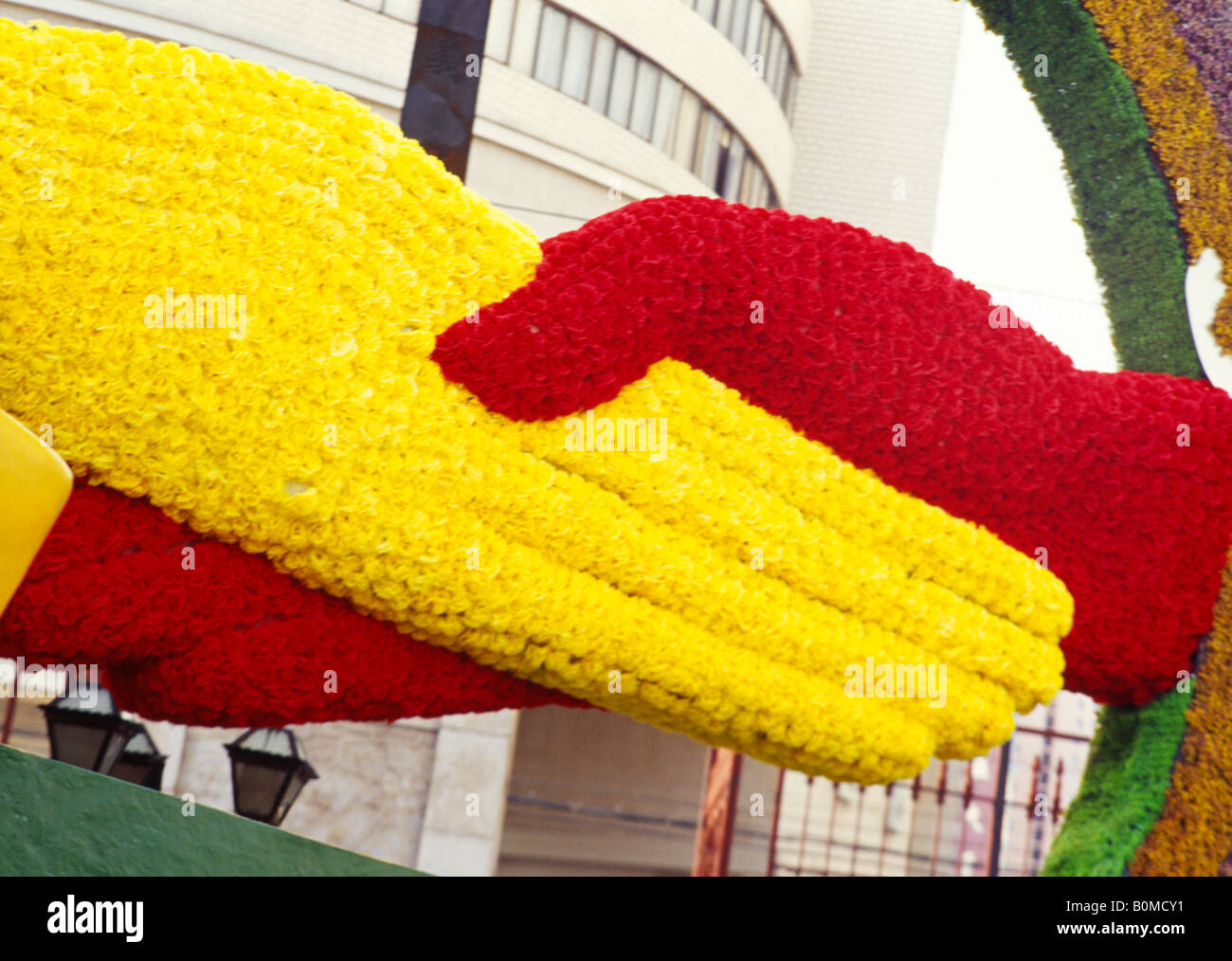 red yellow hand shake Stock Photo - Alamy