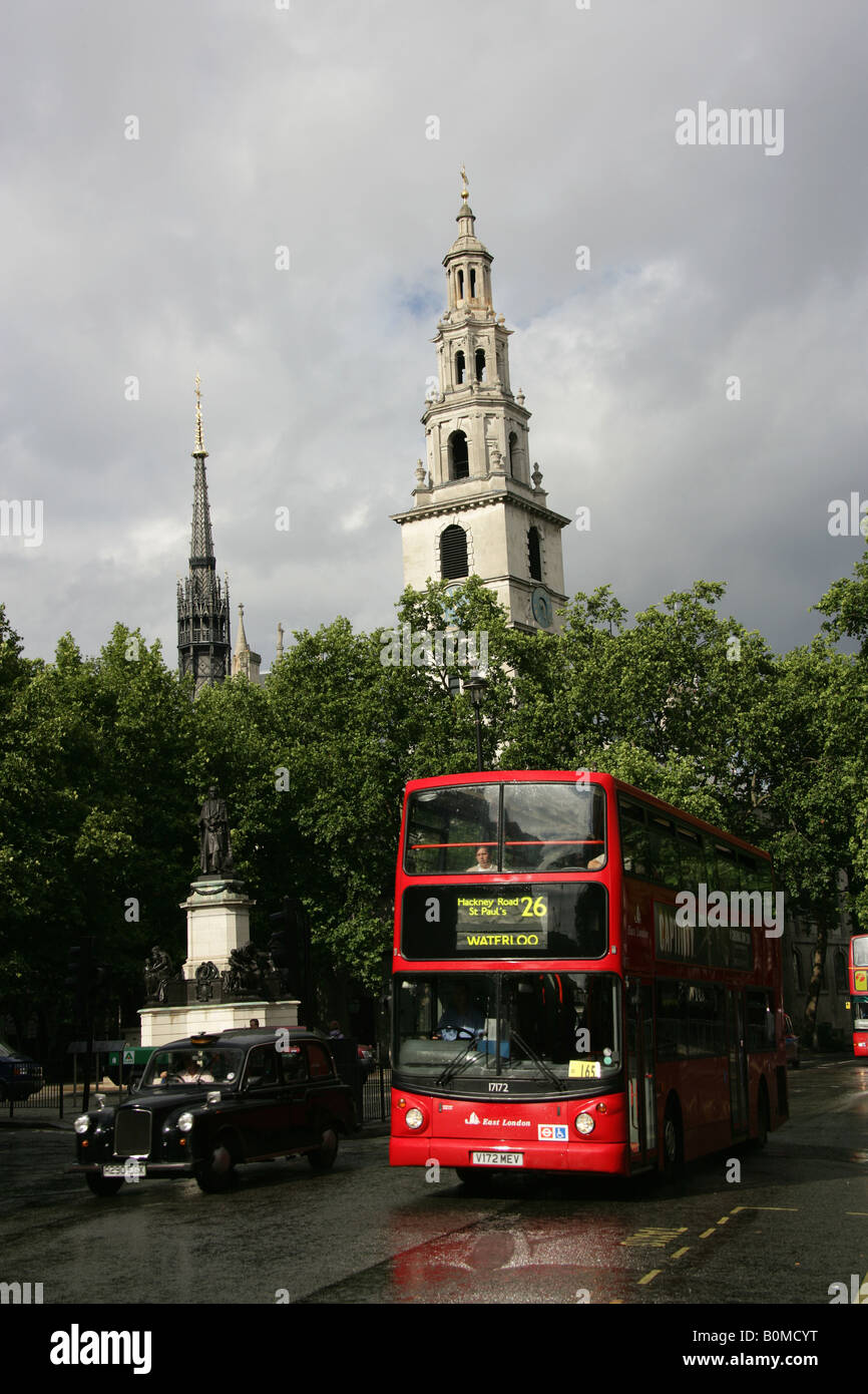 City of London, England. London Transport red bus and Hackney taxi with ...