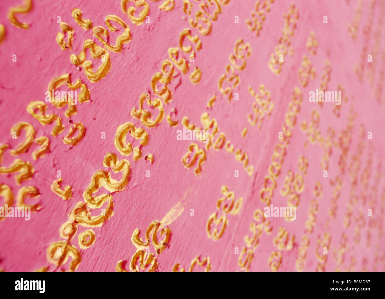 gold inscriptions on red wall Stock Photo - Alamy