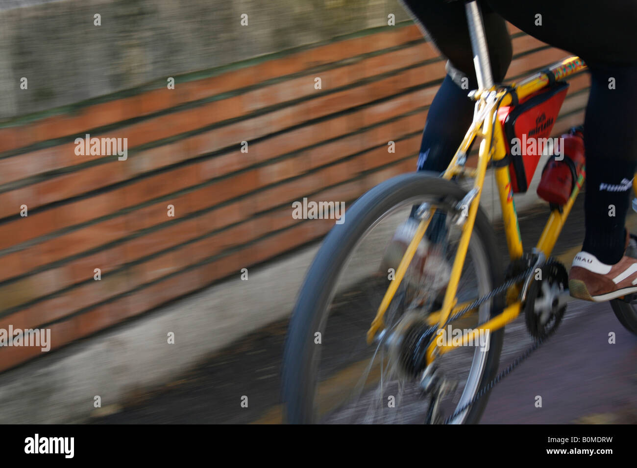 one person riding bike in city street Stock Photo - Alamy