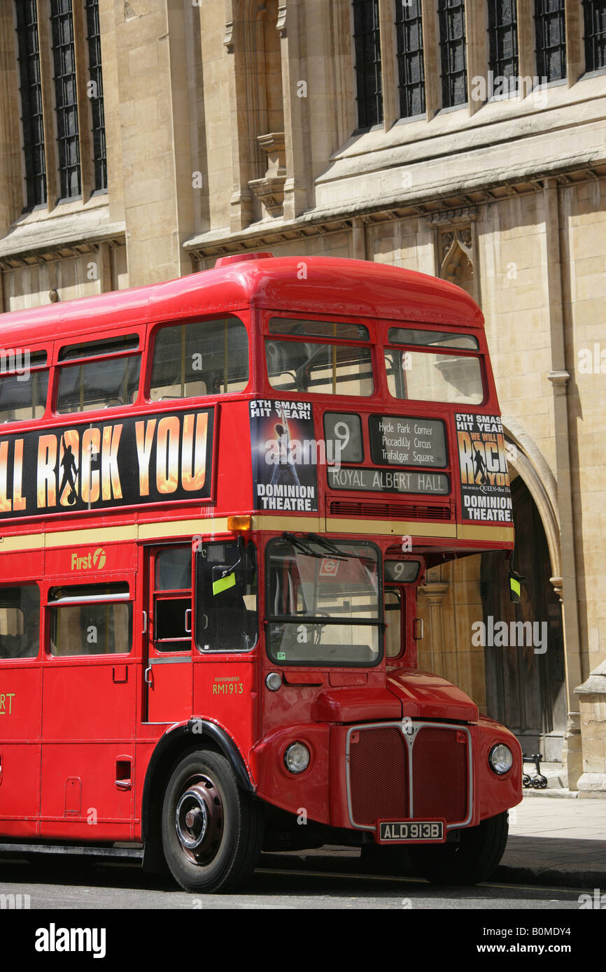 City of London, England. London Transport old red bus parked outside ...