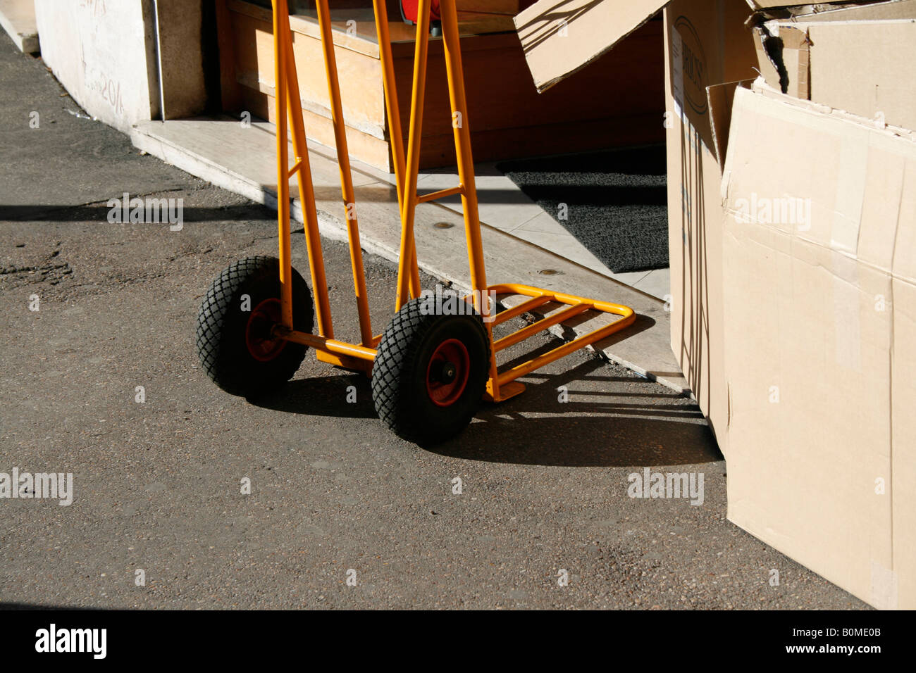 goods delivery trolley and boxes on street Stock Photo - Alamy