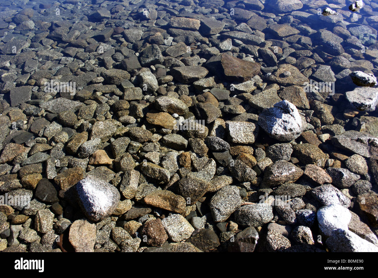 Shallow waters and stones 1 Stock Photo - Alamy