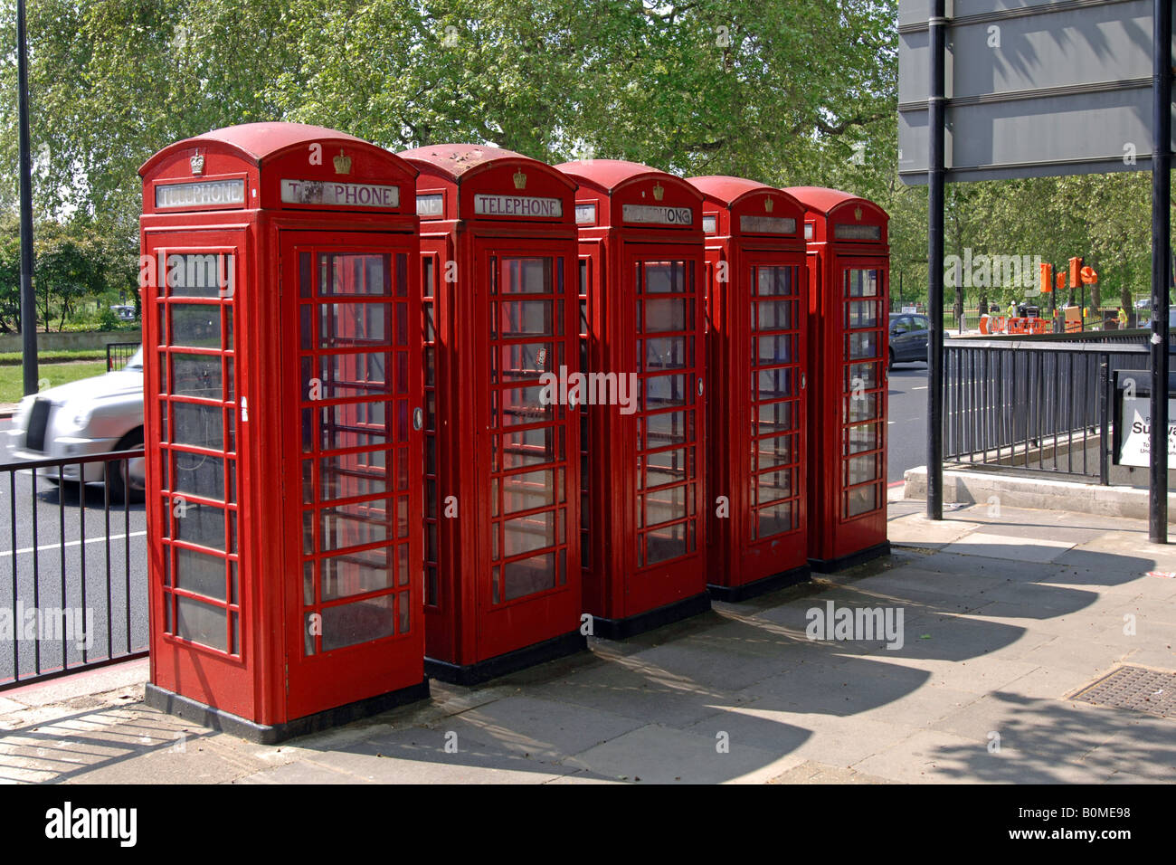 Group of five red telelphone boxes in London Stock Photo - Alamy