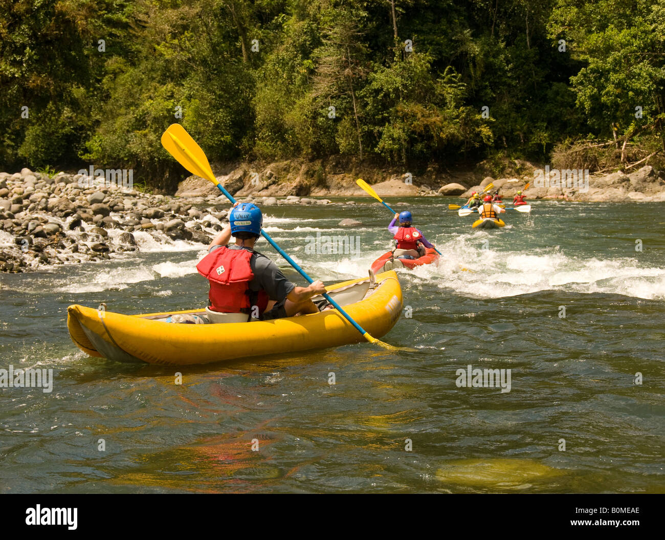 COSTA RICA Kayakers whitewater kayaking on the Lower Pacuare River ...