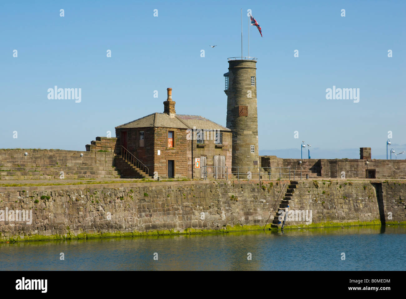 Old quay at Whitehaven harbour, Cumbria UK, with old pier master's ...