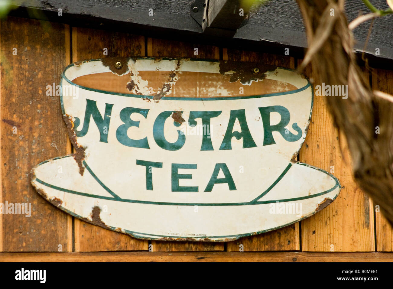 Old fashioned enamel advertising sign for Nectar Tea Stock Photo - Alamy