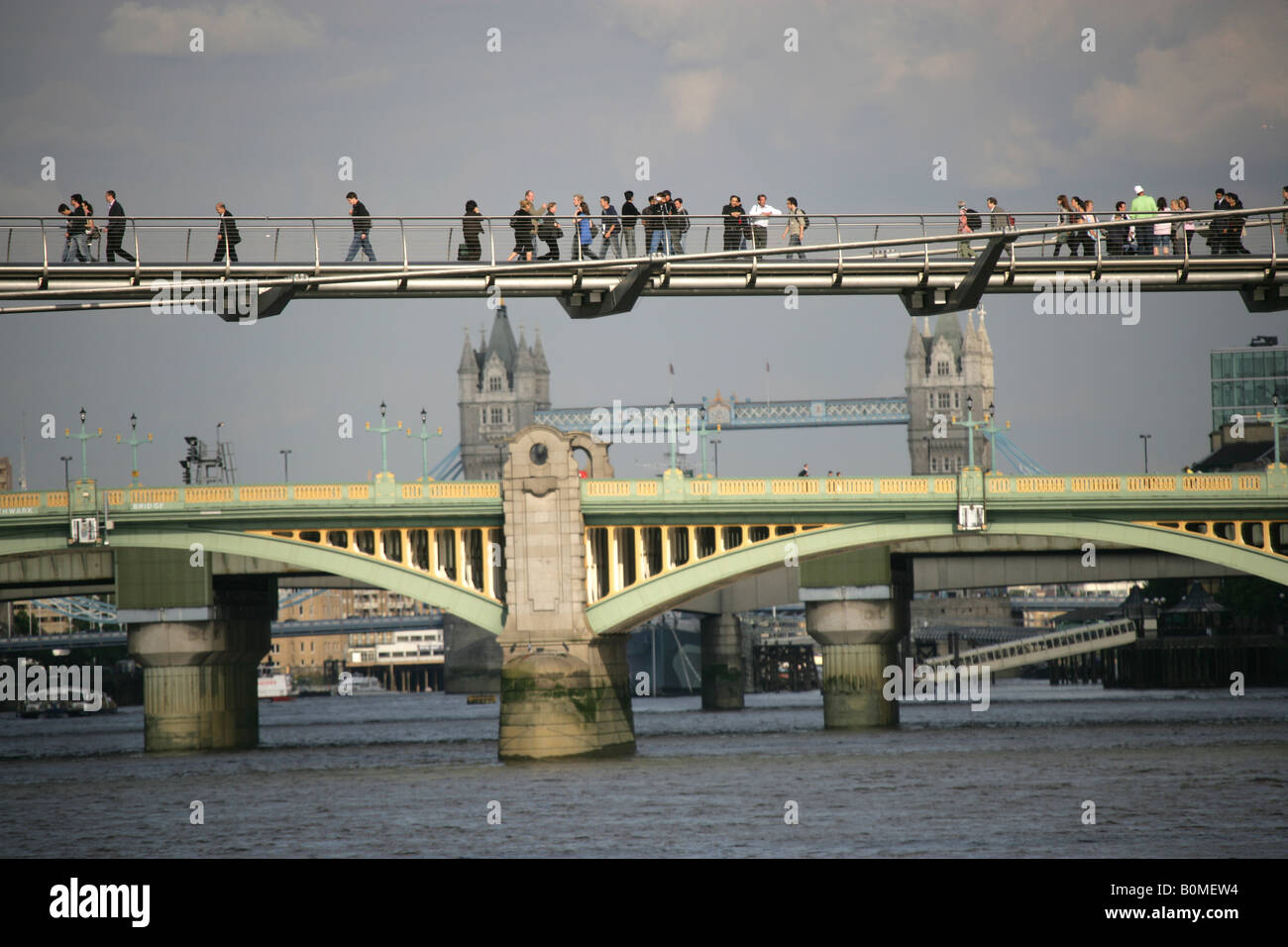 City of London, England. Pedestrians crossing the Millennium Bridge ...