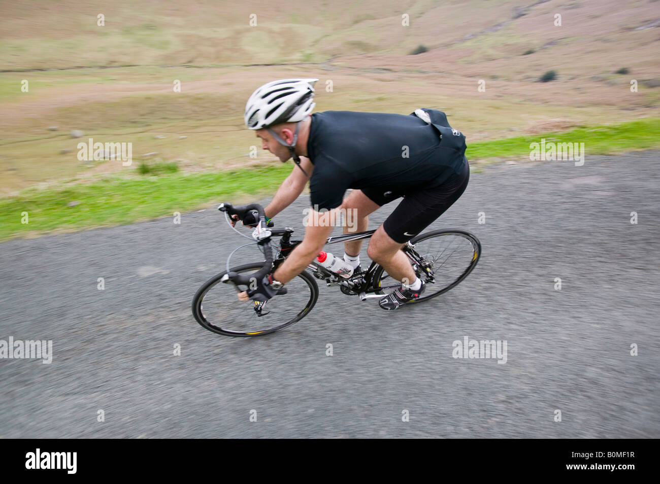 A cyclist descending Wrynose Pass on the Fred Whitton challenge in the ...
